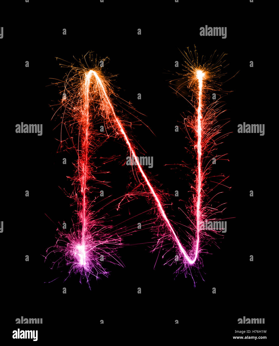 Sparkler firework light alphabet N (Capital Letters) at night ...