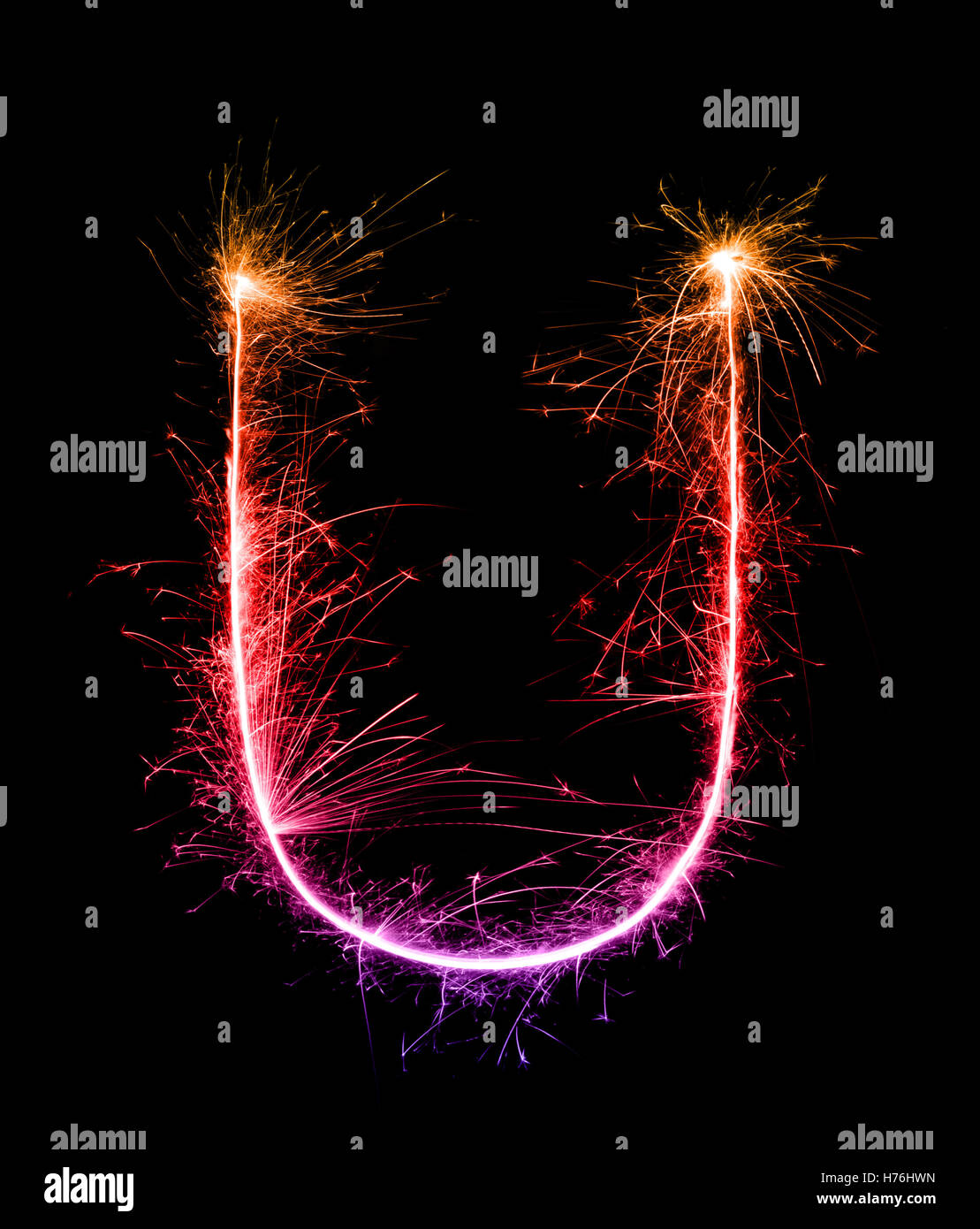 Sparkler firework light alphabet U (Capital Letters) at night ...
