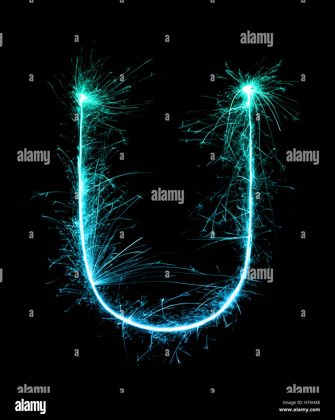 Sparkler firework light alphabet U (Capital Letters) at night ...