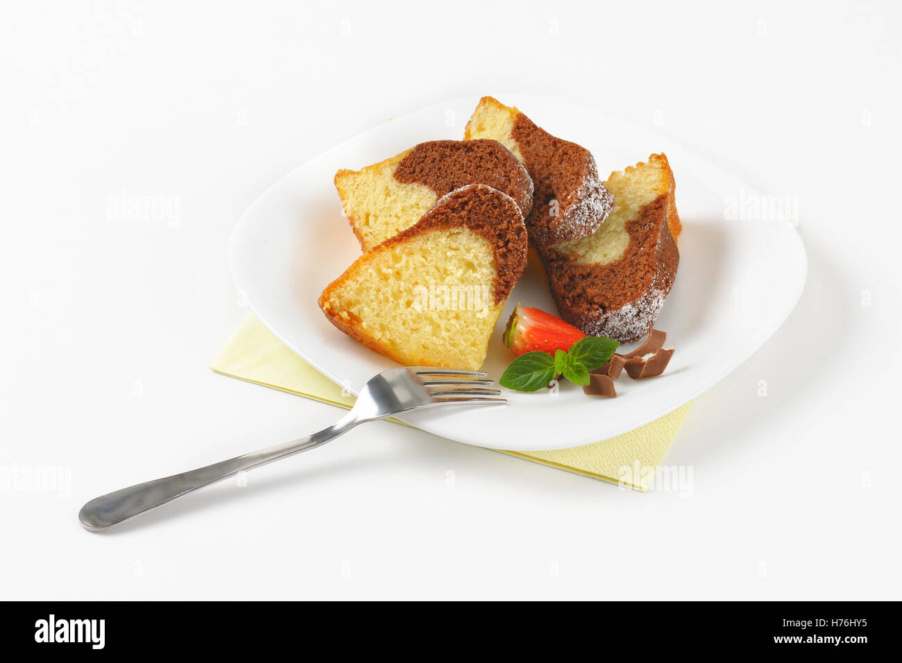 slices of marble bundt cake on white plate Stock Photo - Alamy