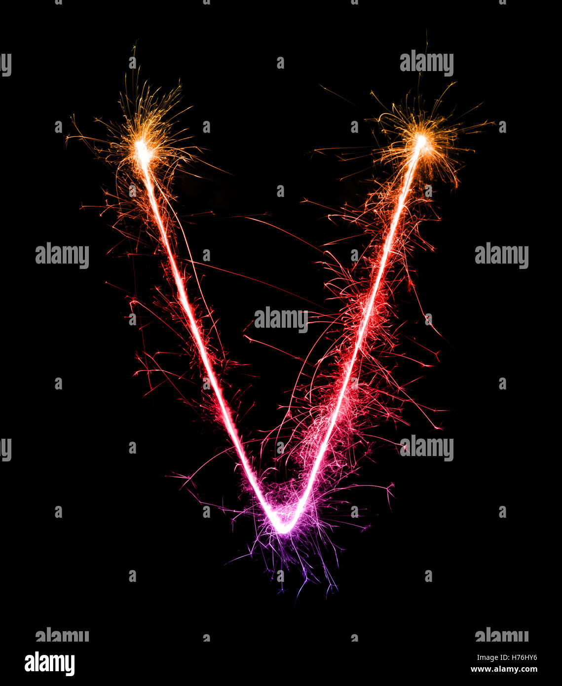 Sparkler firework light alphabet V at night background Stock Photo - Alamy