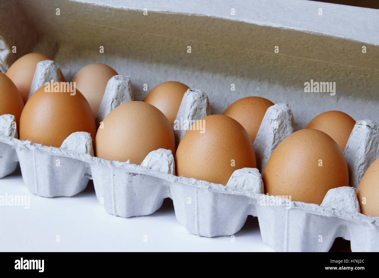 Closeup of eggs in carton Stock Photo - Alamy