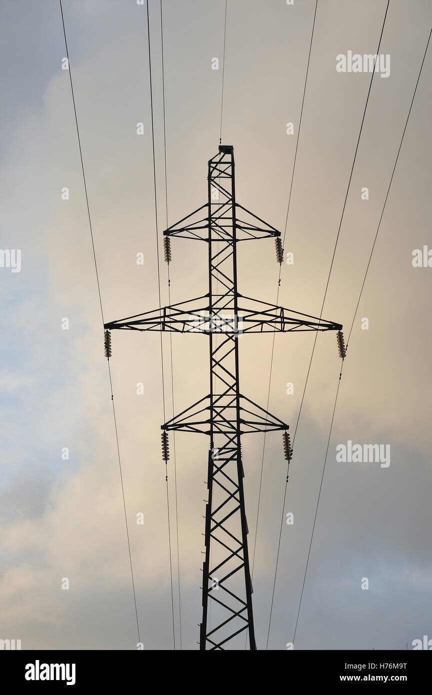 High voltage power line on the evening sky background Stock Photo - Alamy