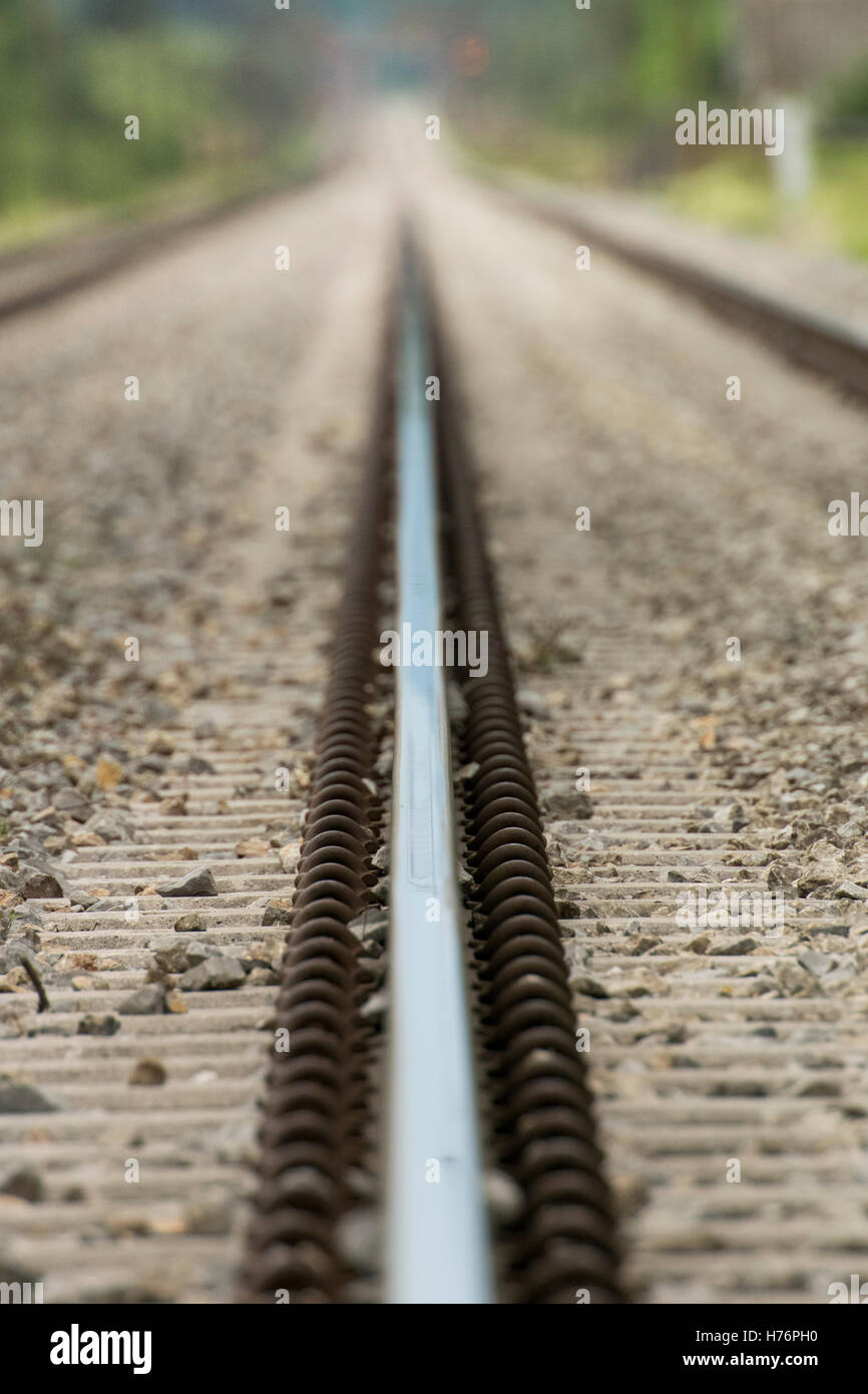 Detailed close up photo of a railroad track Stock Photo - Alamy