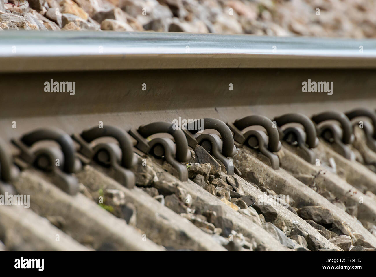 Detailed close up photo of a railroad track Stock Photo - Alamy