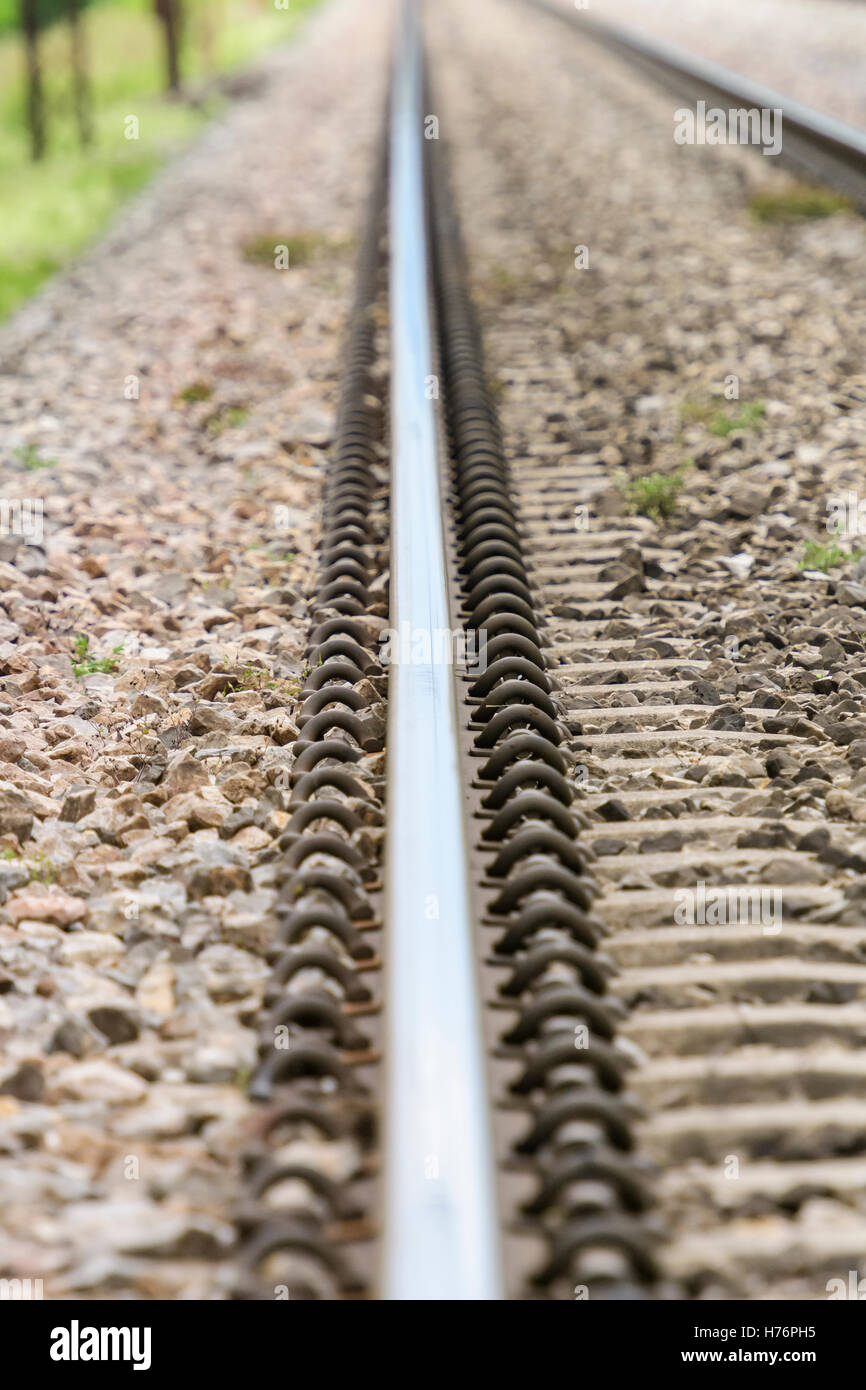Detailed close up photo of a railroad track Stock Photo - Alamy