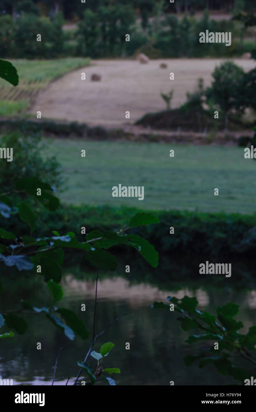 The Orne river and nearby fields, near the villages of Clecy and Le Vey ...