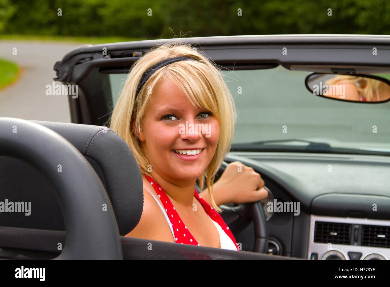 Beautiful woman driver in open top convertible Stock Photo - Alamy