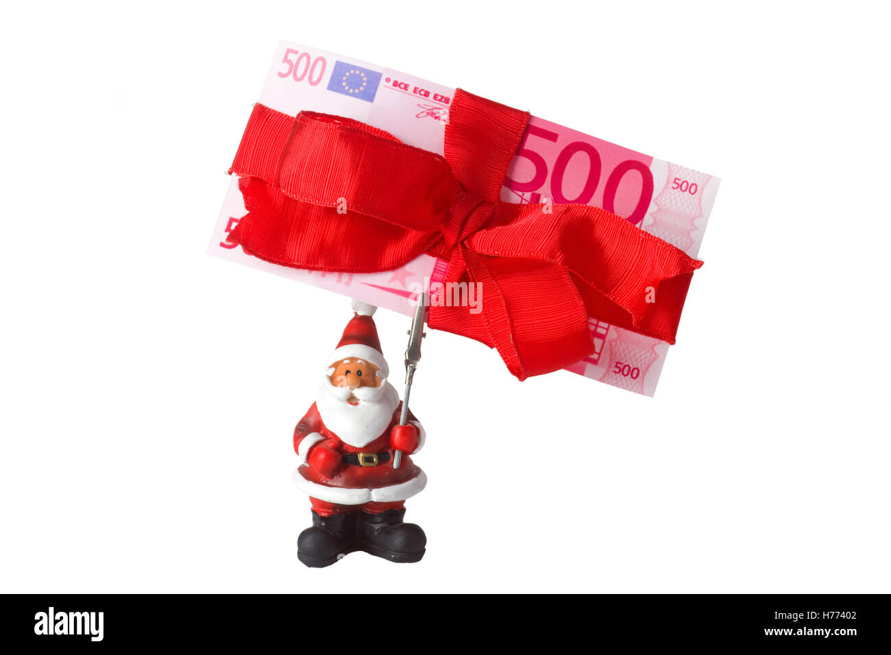 Santa Clause paper holder with five hundred Euro banknote Stock Photo ...