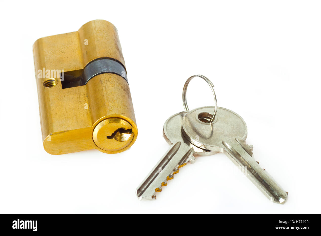 Key cylinder with keys on white background Stock Photo - Alamy