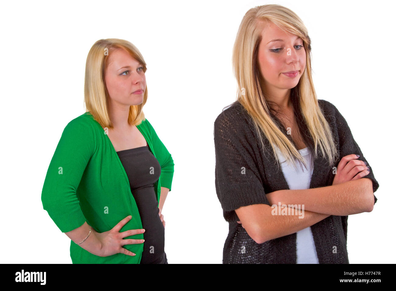 Two woman friends have an argue with each other- isolated on white ...