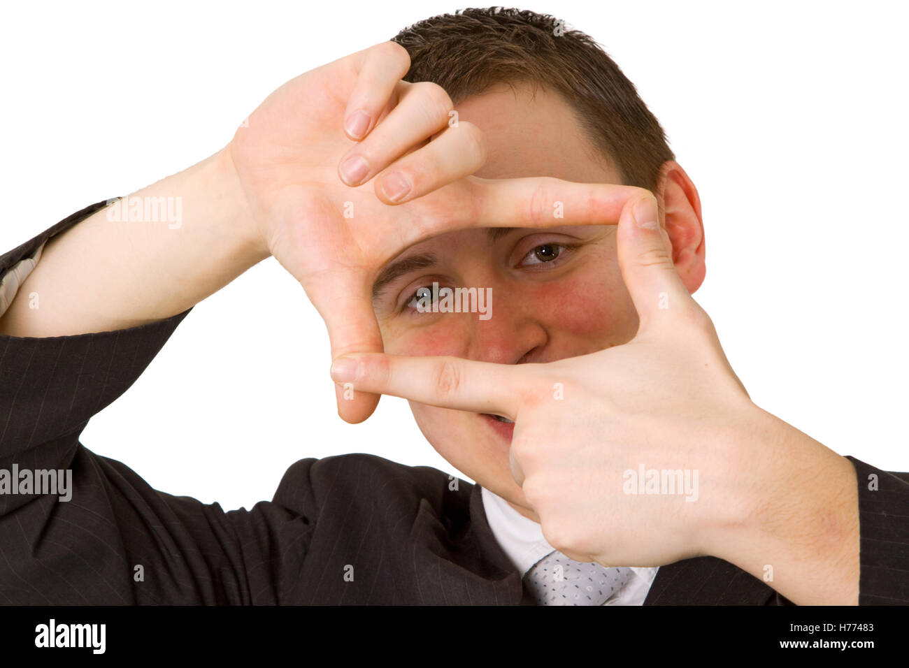 Young businessman shows a frame with his hands Stock Photo - Alamy