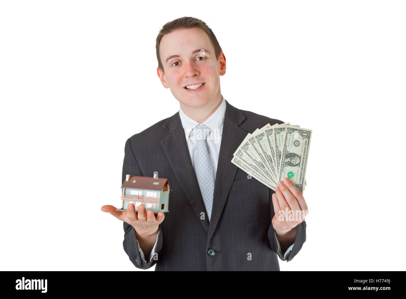 Male real estate agent with modell house over white background Stock ...