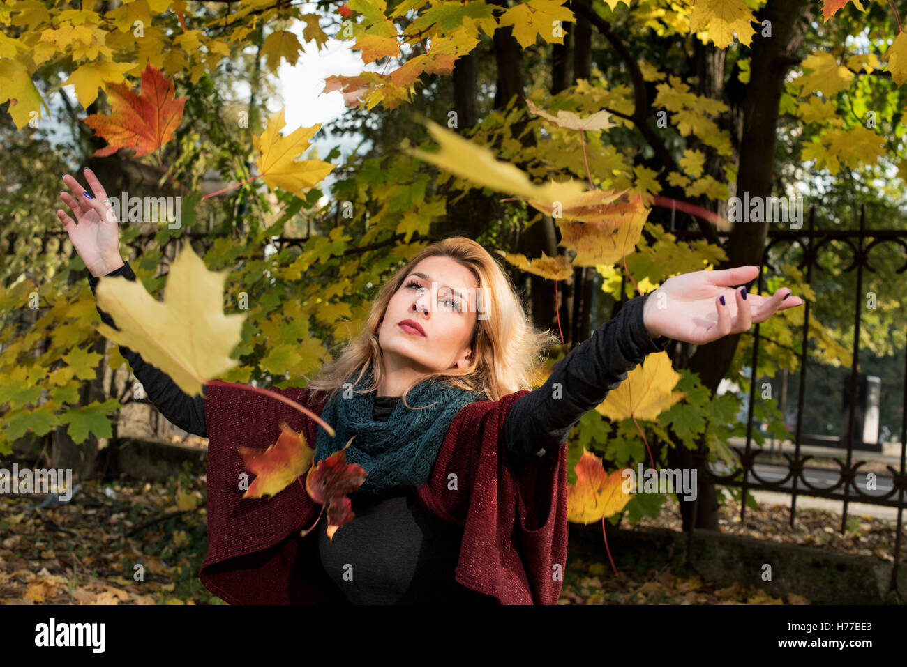 Playful woman in autumn hi-res stock photography and images - Alamy