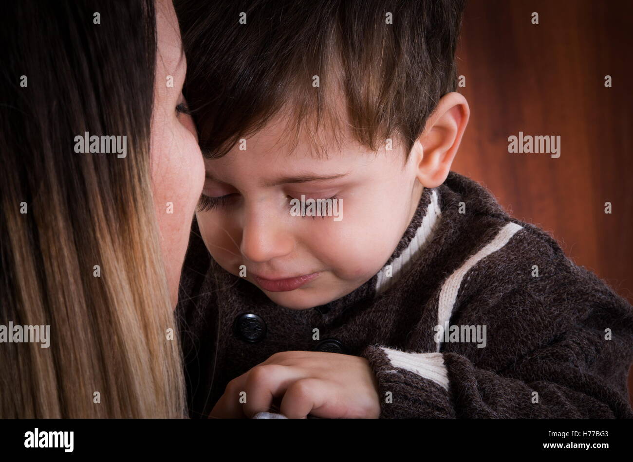 portrait of mother and her little sad son Stock Photo - Alamy