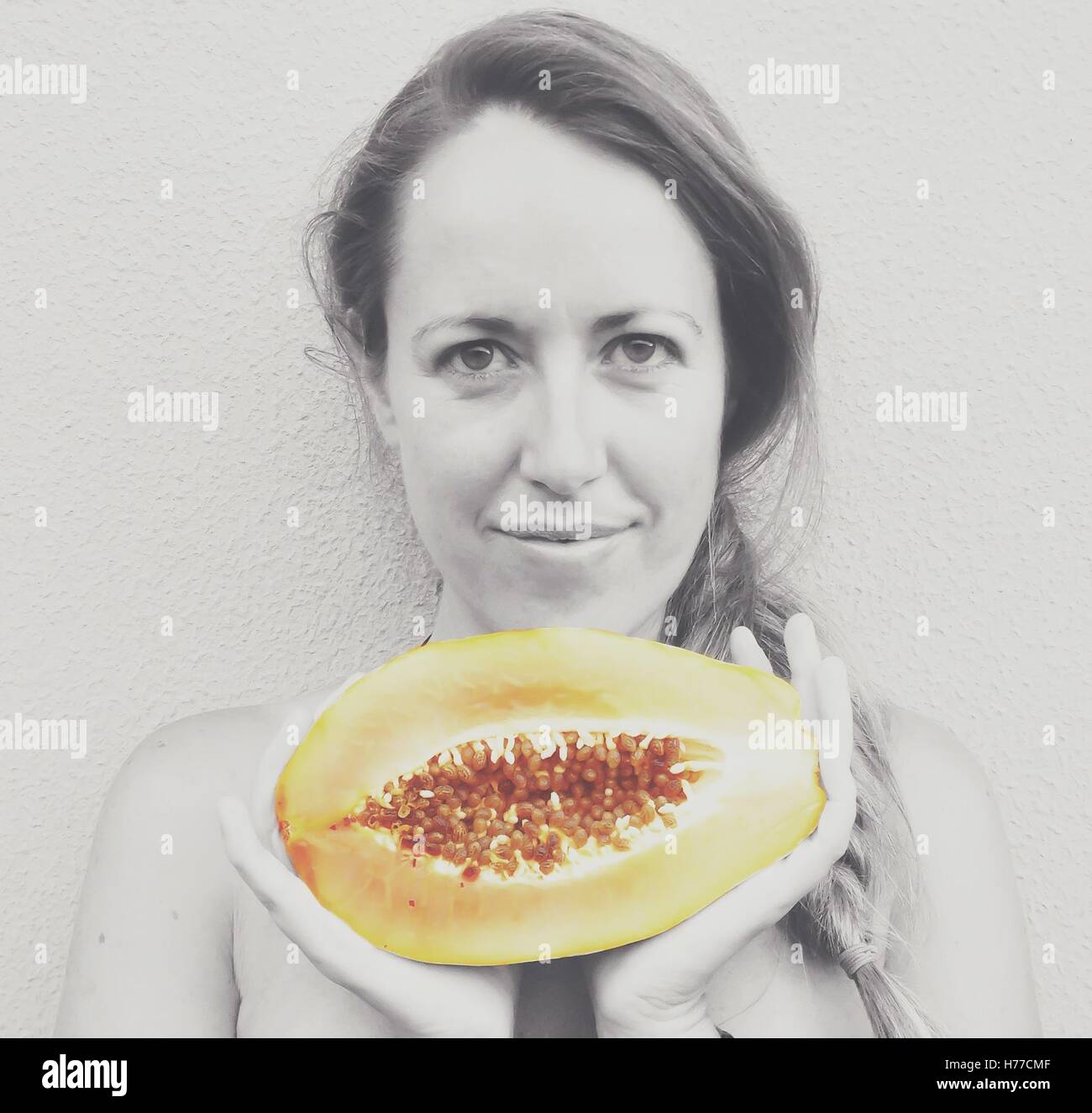 Woman papaya looking at camera hi-res stock photography and images - Alamy