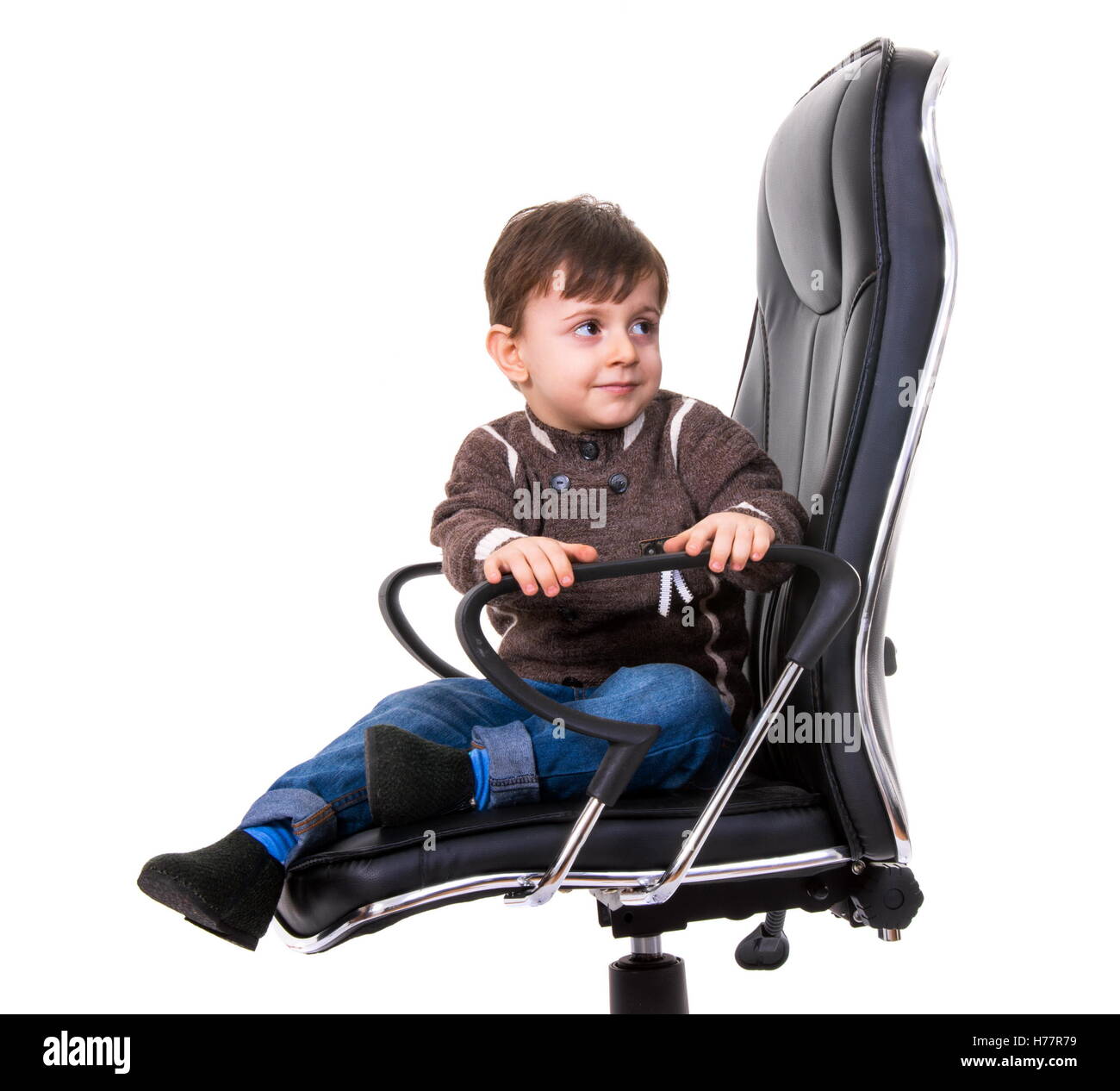 little boy sitting on chair Stock Photo - Alamy