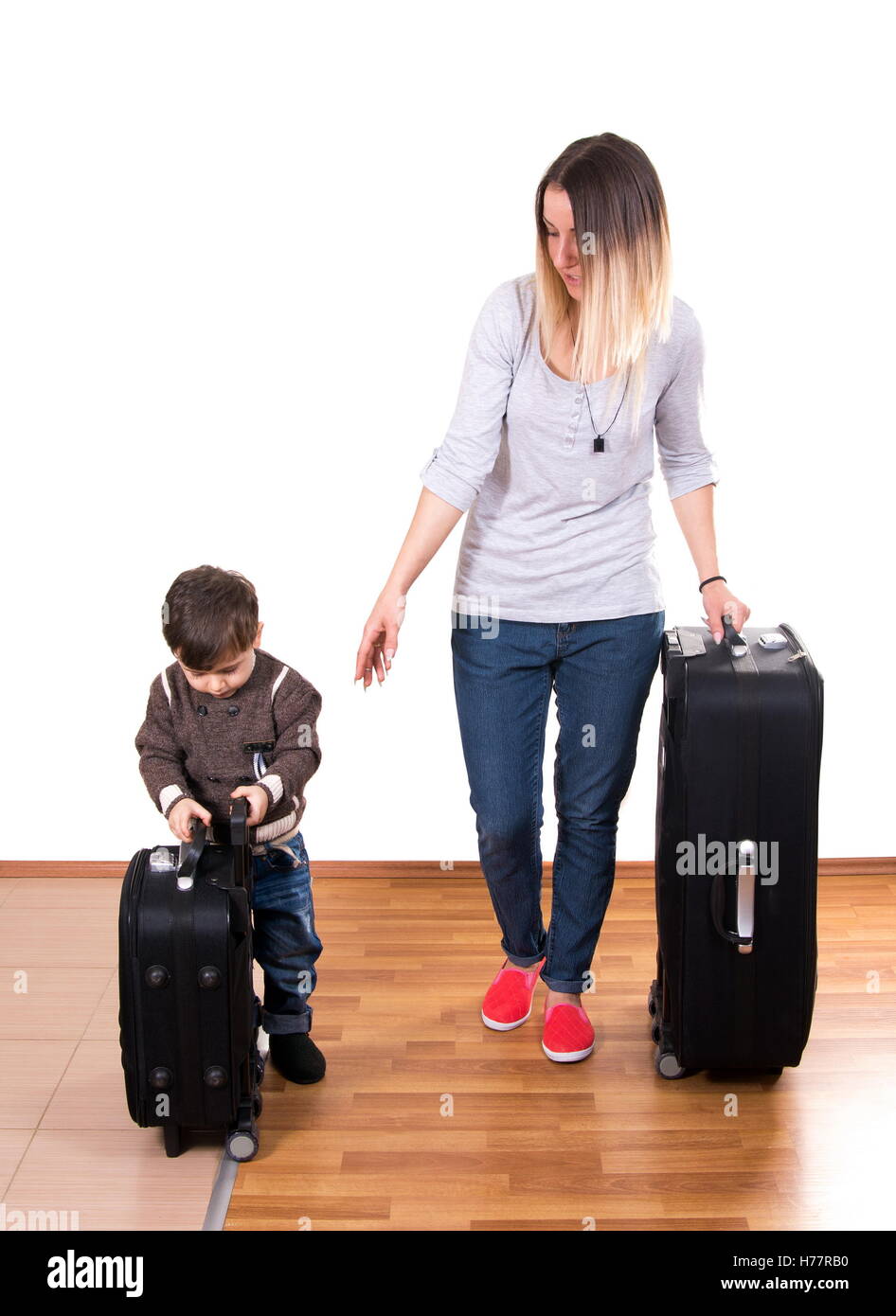 child with mother packing bags for holiday Stock Photo - Alamy
