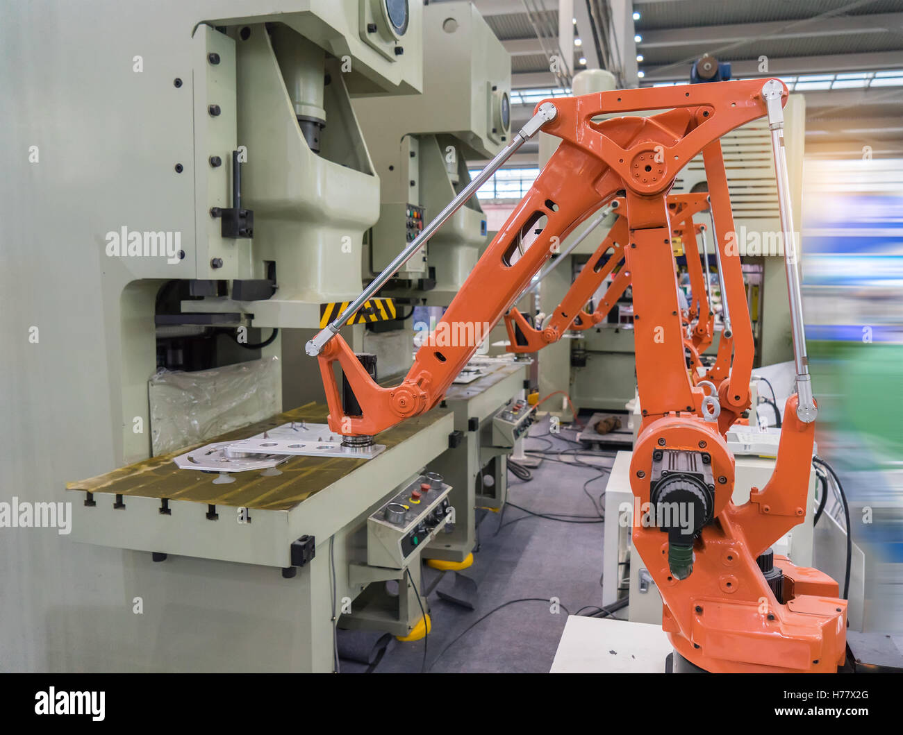 Robotic arm at production line in factory Stock Photo - Alamy