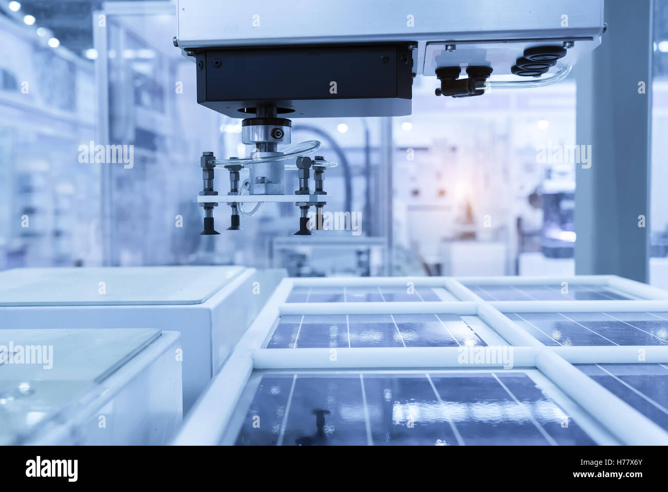 production of solar panels, Industrial robot working in factory ...