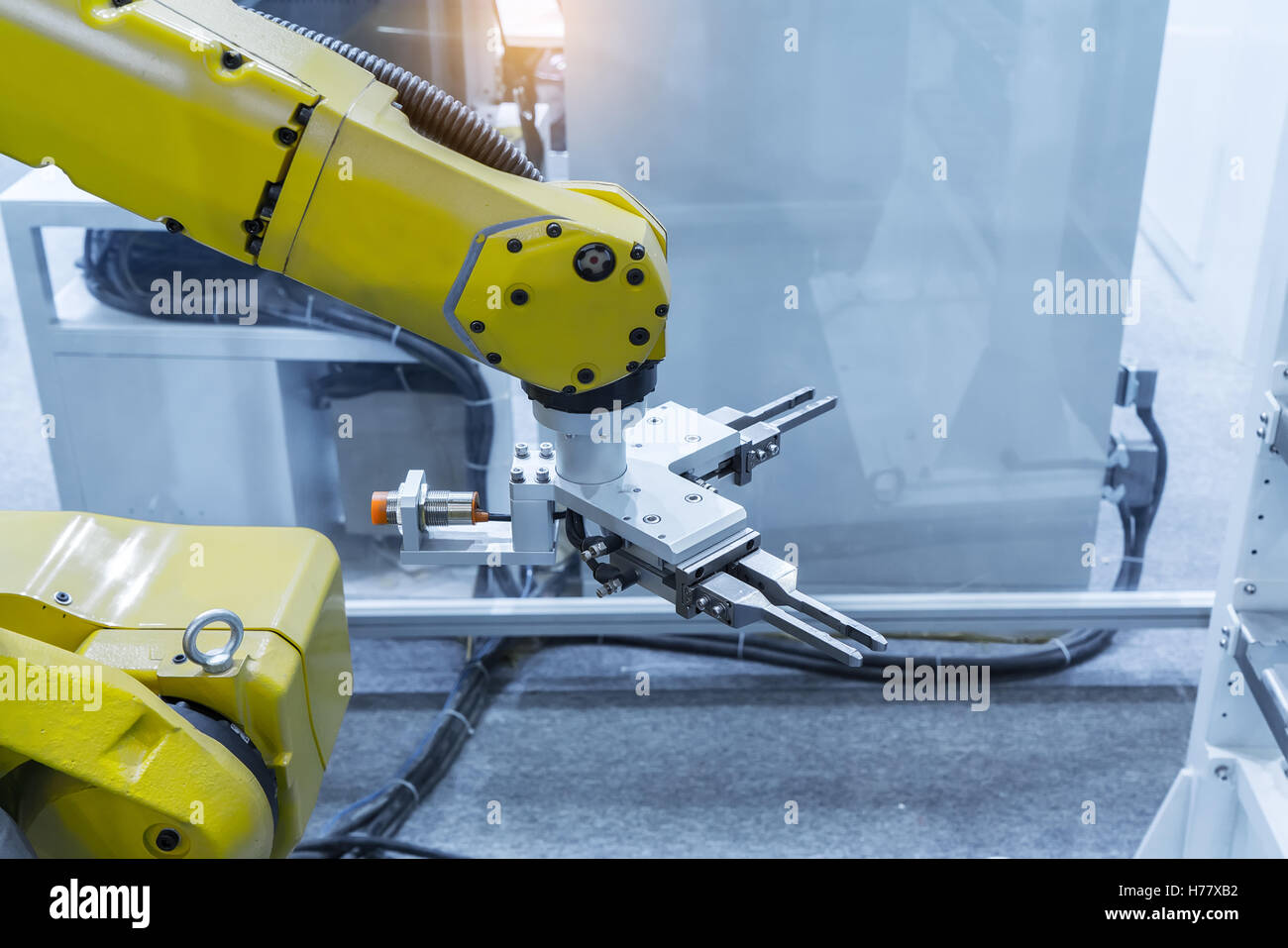 Robotic arm at production line in factory Stock Photo - Alamy