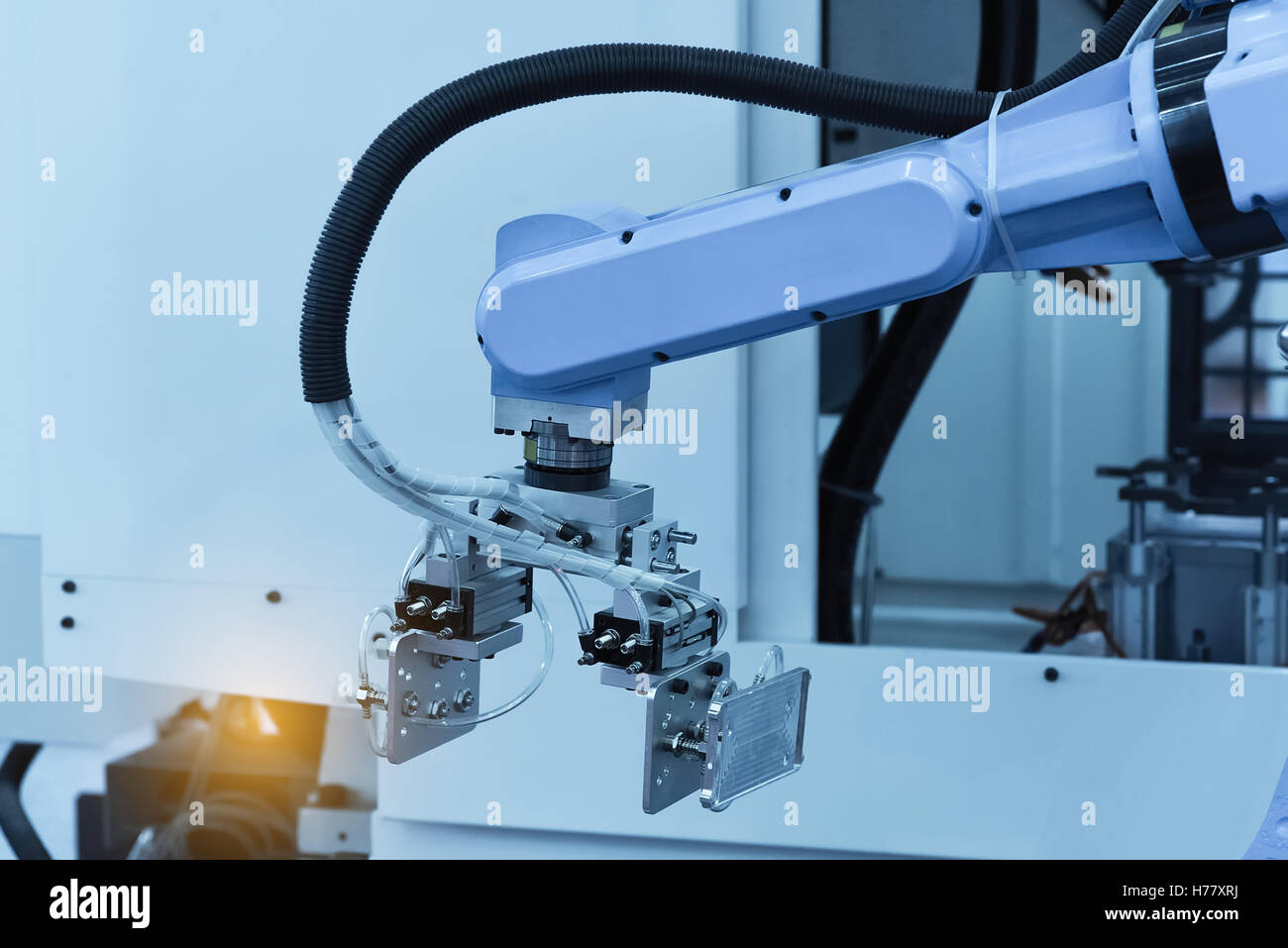 Robotic arm at production line in factory Stock Photo - Alamy