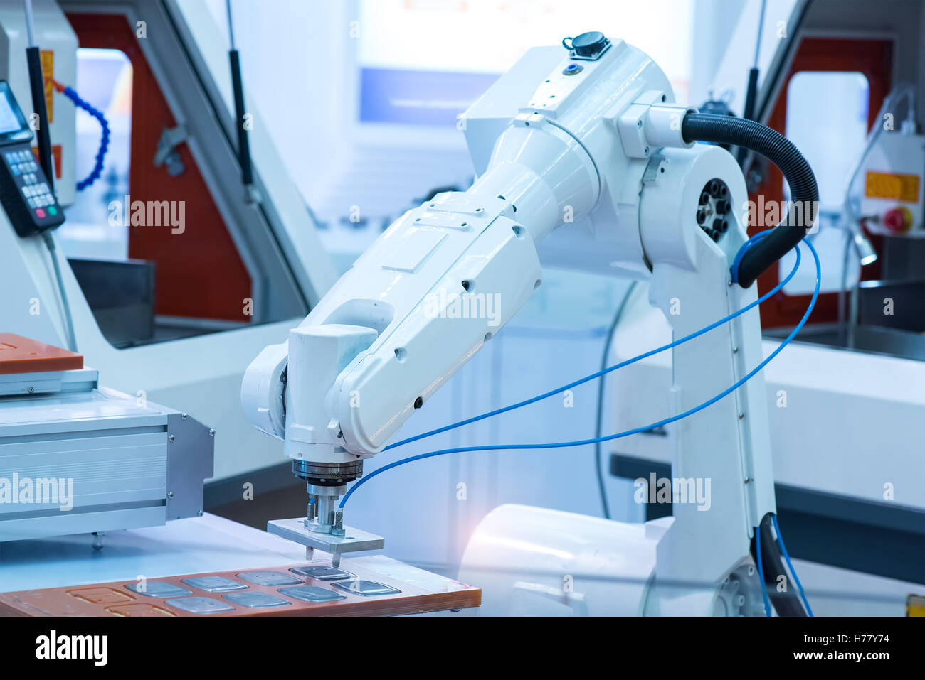 Robotic arm at production line in factory Stock Photo - Alamy