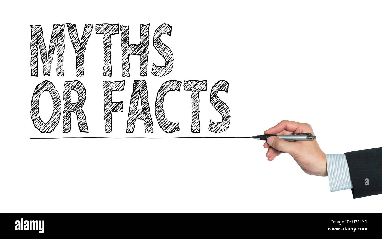 myths or facts written by hand, hand writing on transparent board ...