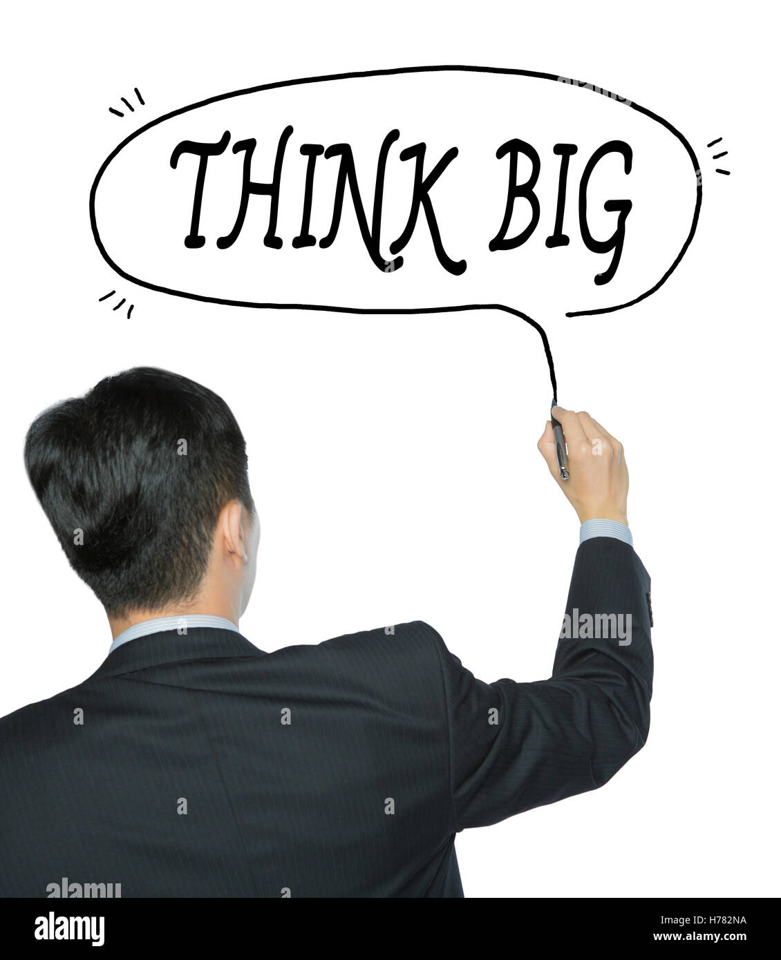 think big written by businessman in black suit, hand writing on ...