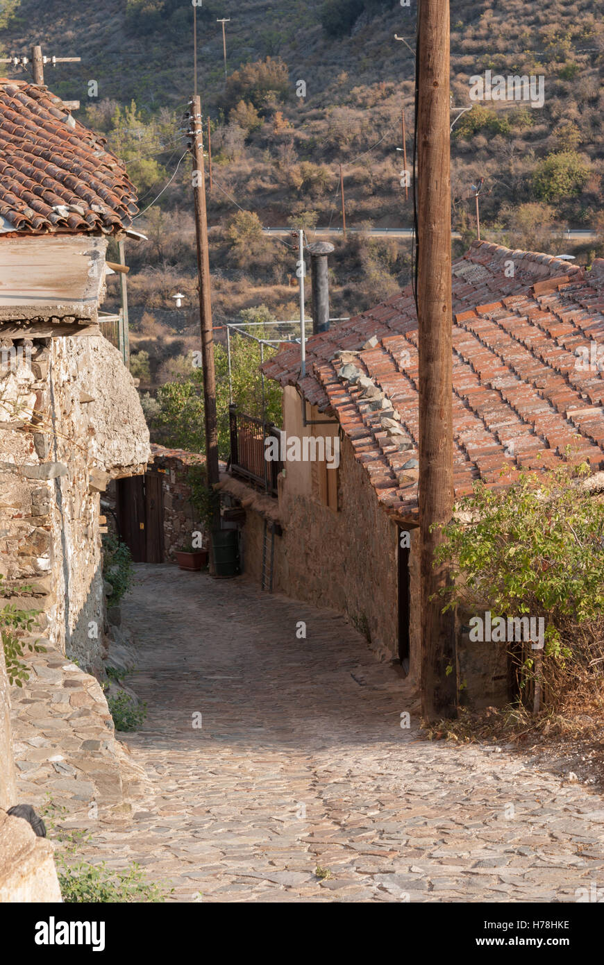 View on the cobblestone street of the traditional hillside village in ...