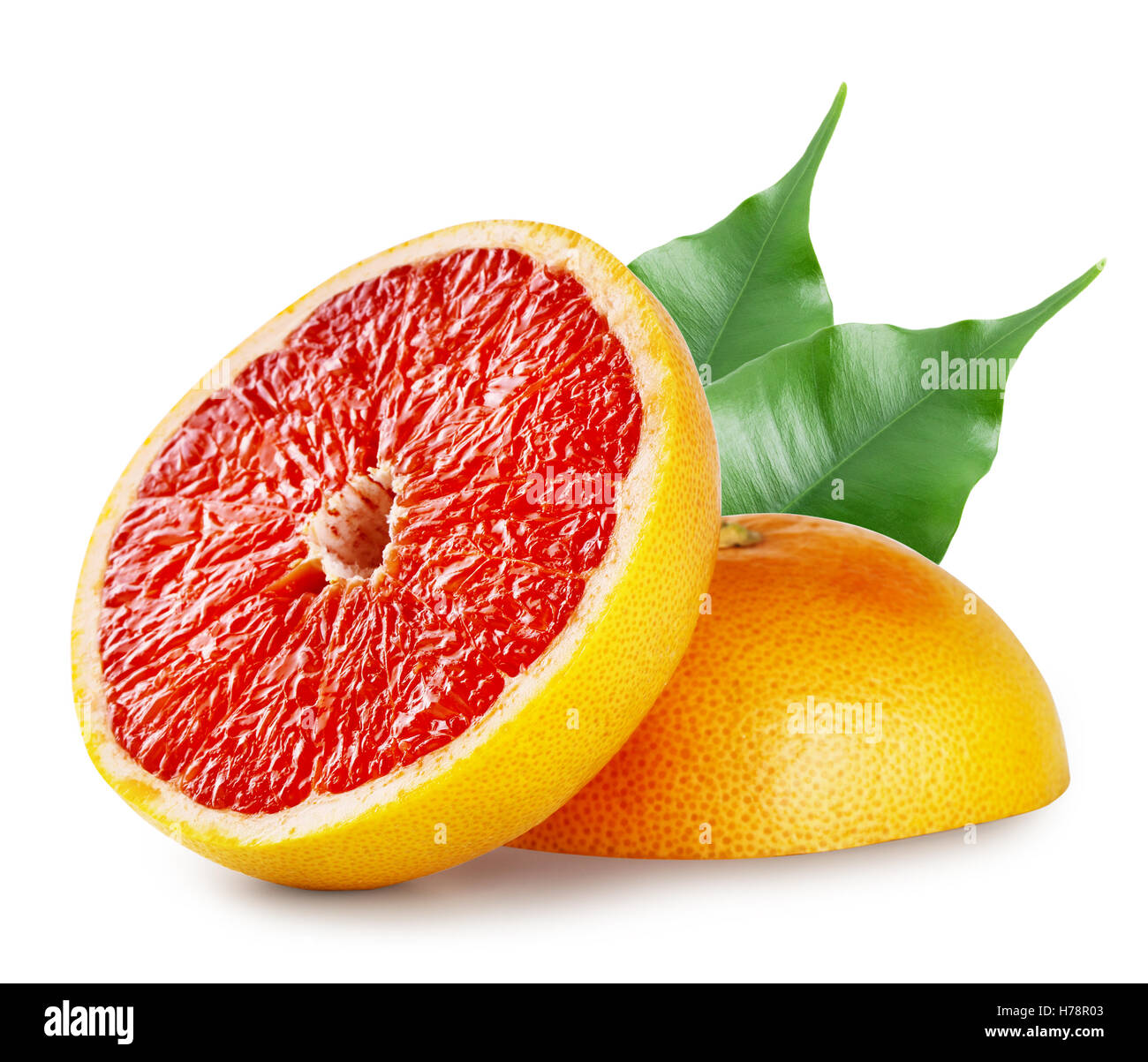 Cut a ripe grapefruit with leaves isolated on white background Stock ...