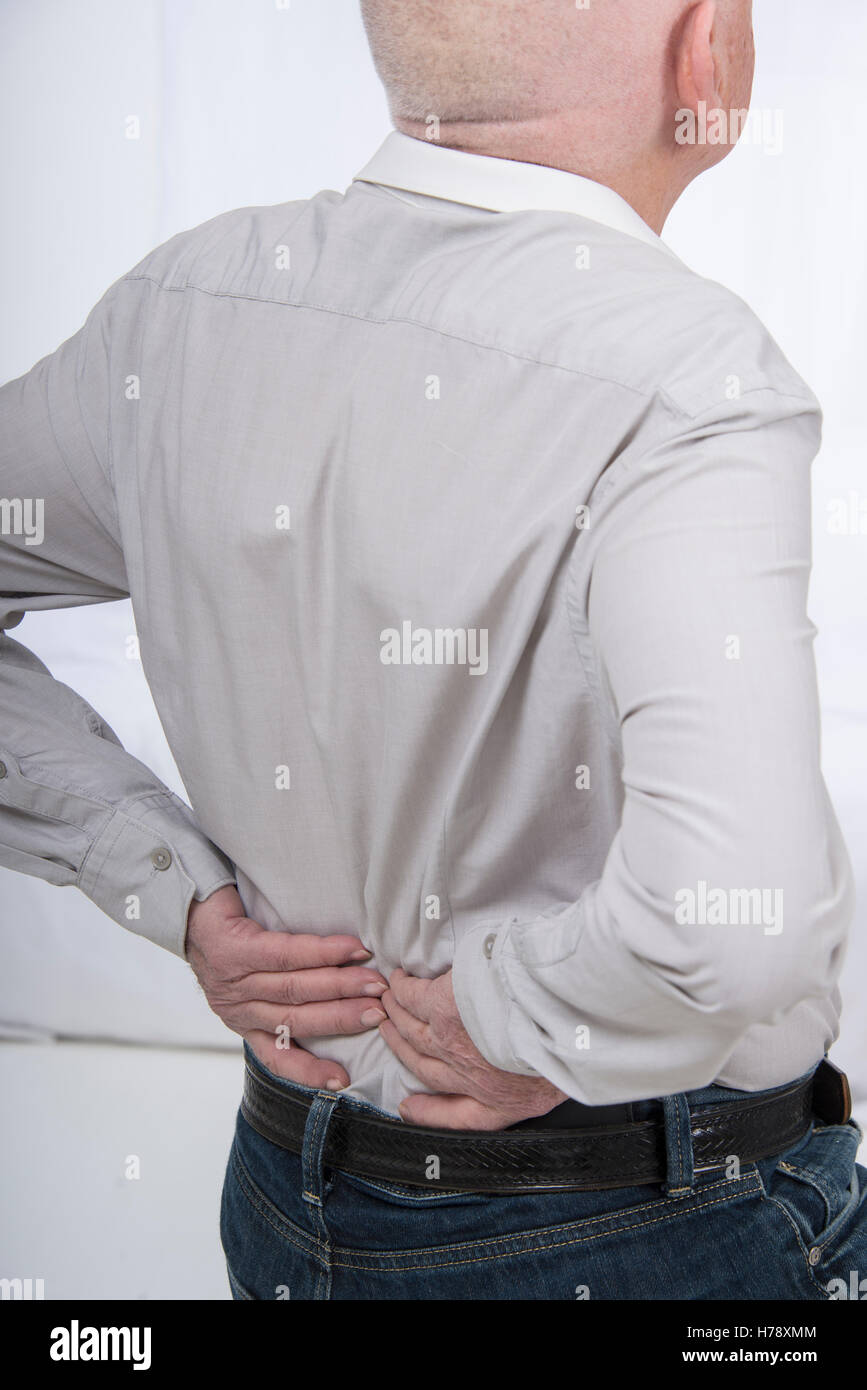 SENIOR WITH LOWER BACK PAIN Stock Photo - Alamy