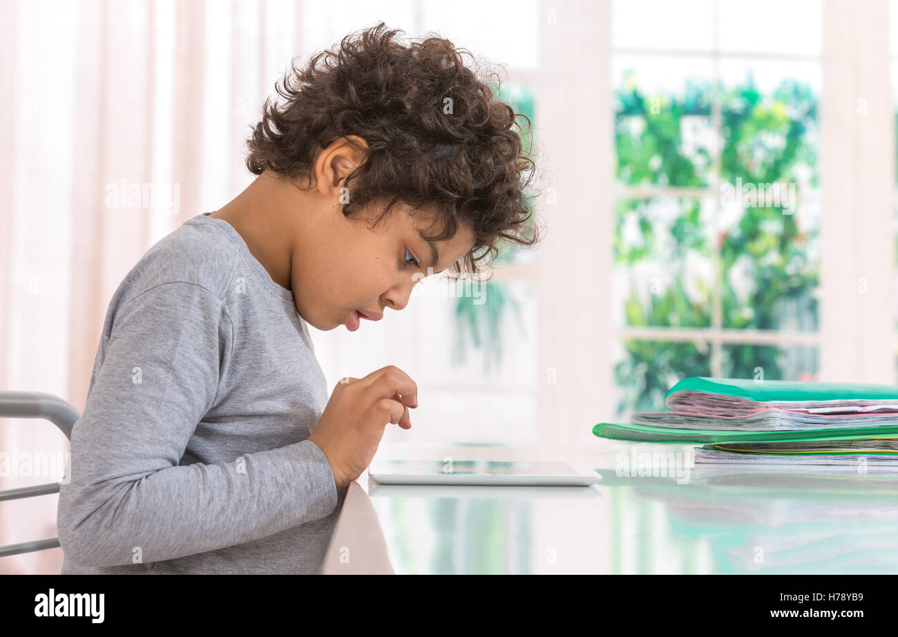 CHILD WITH TABLET Stock Photo - Alamy