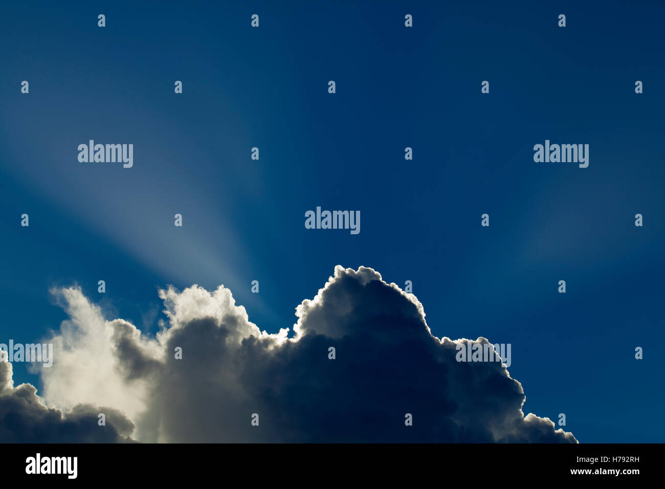 sun behind cumulus clouds natural skyscape background Stock Photo - Alamy