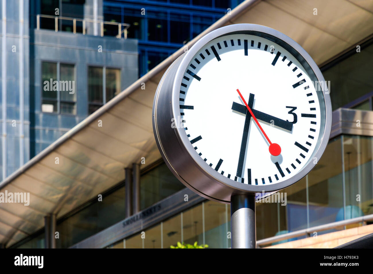 Public clock in Canary Wharf, financial district in London Stock Photo ...