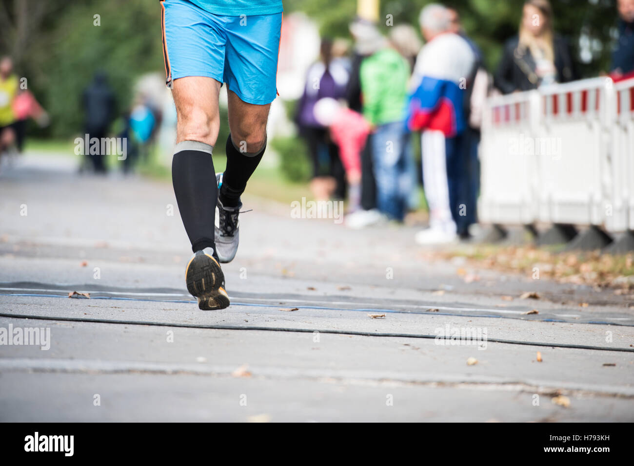 Legs of unrecognizable runner outdoors. Long distance running Stock ...