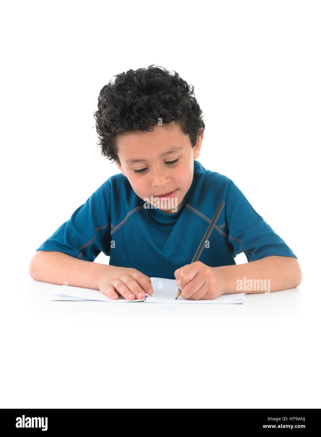 Young Boy Writing His Homework Isolated on White Background Stock Photo ...