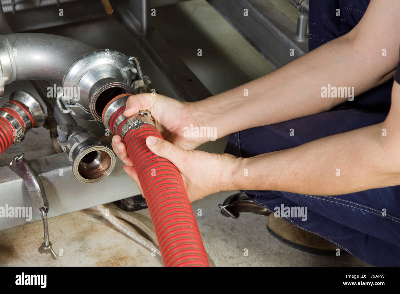 skilled worker fitting a pump plant in a industrial company Stock Photo ...