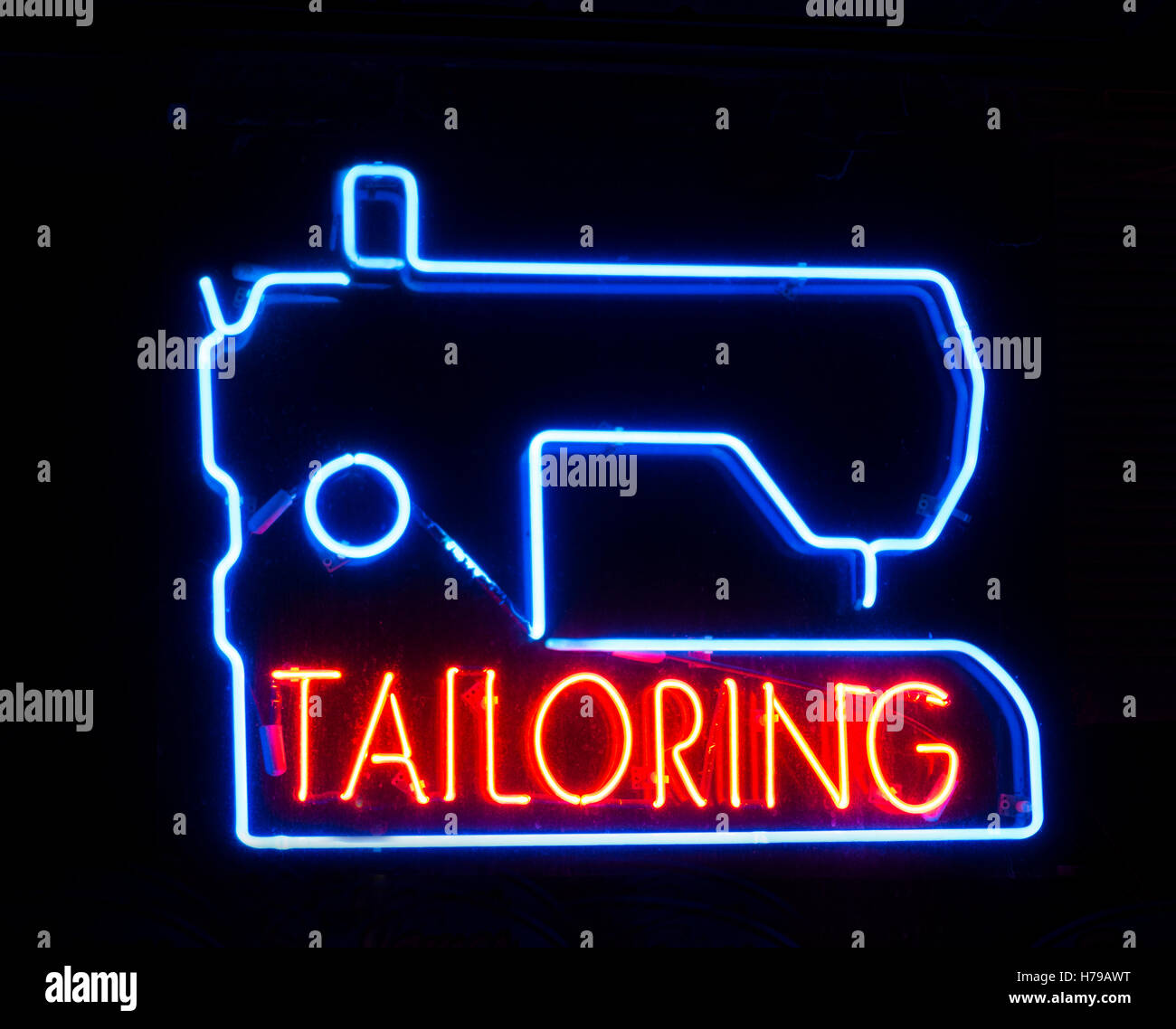 neon sign tailoring Stock Photo - Alamy