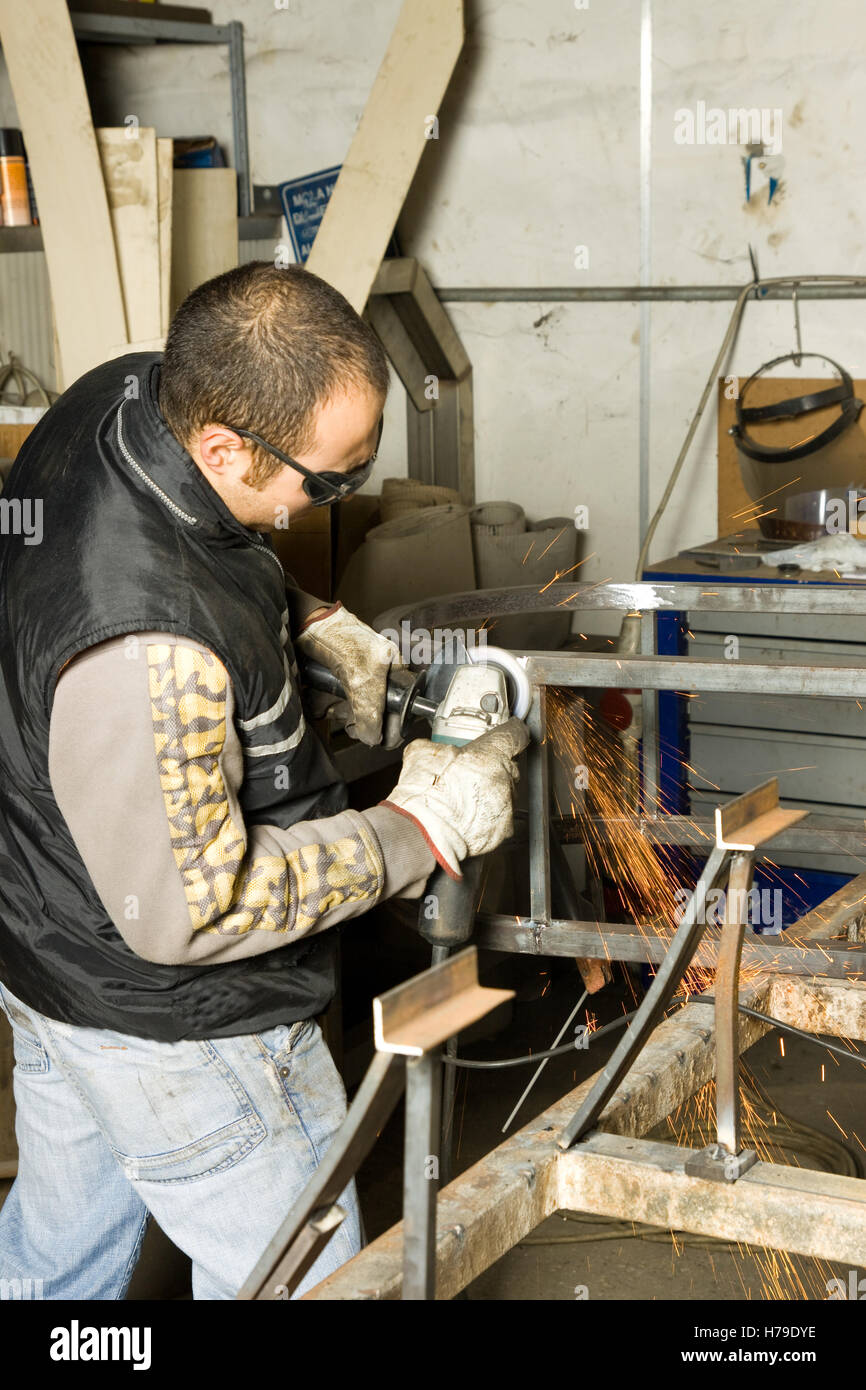 metalworker at work in his workshop Stock Photo - Alamy