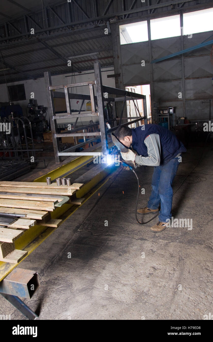 metalworker at work in his workshop Stock Photo - Alamy