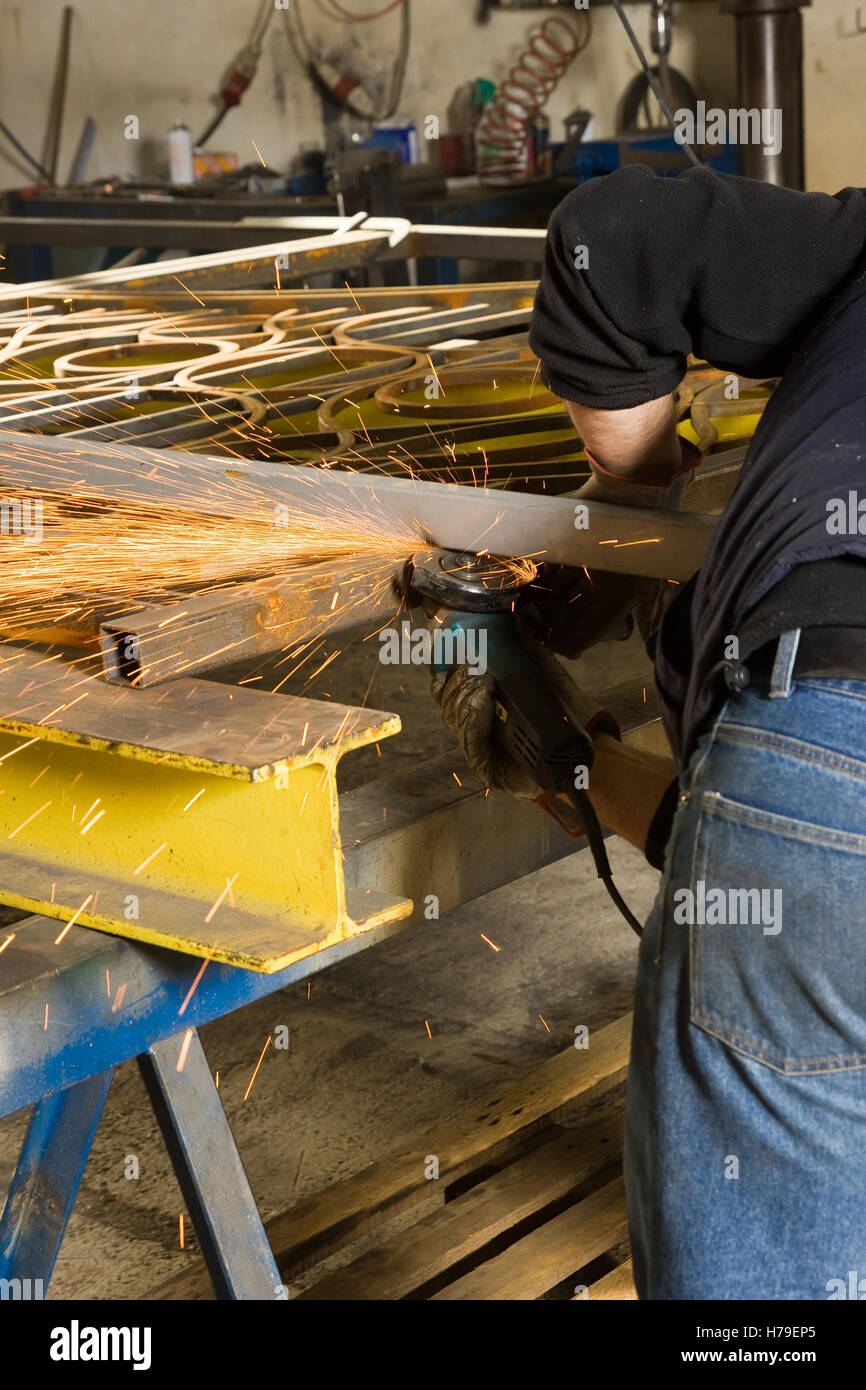 metalworker welding in his workshop Stock Photo - Alamy