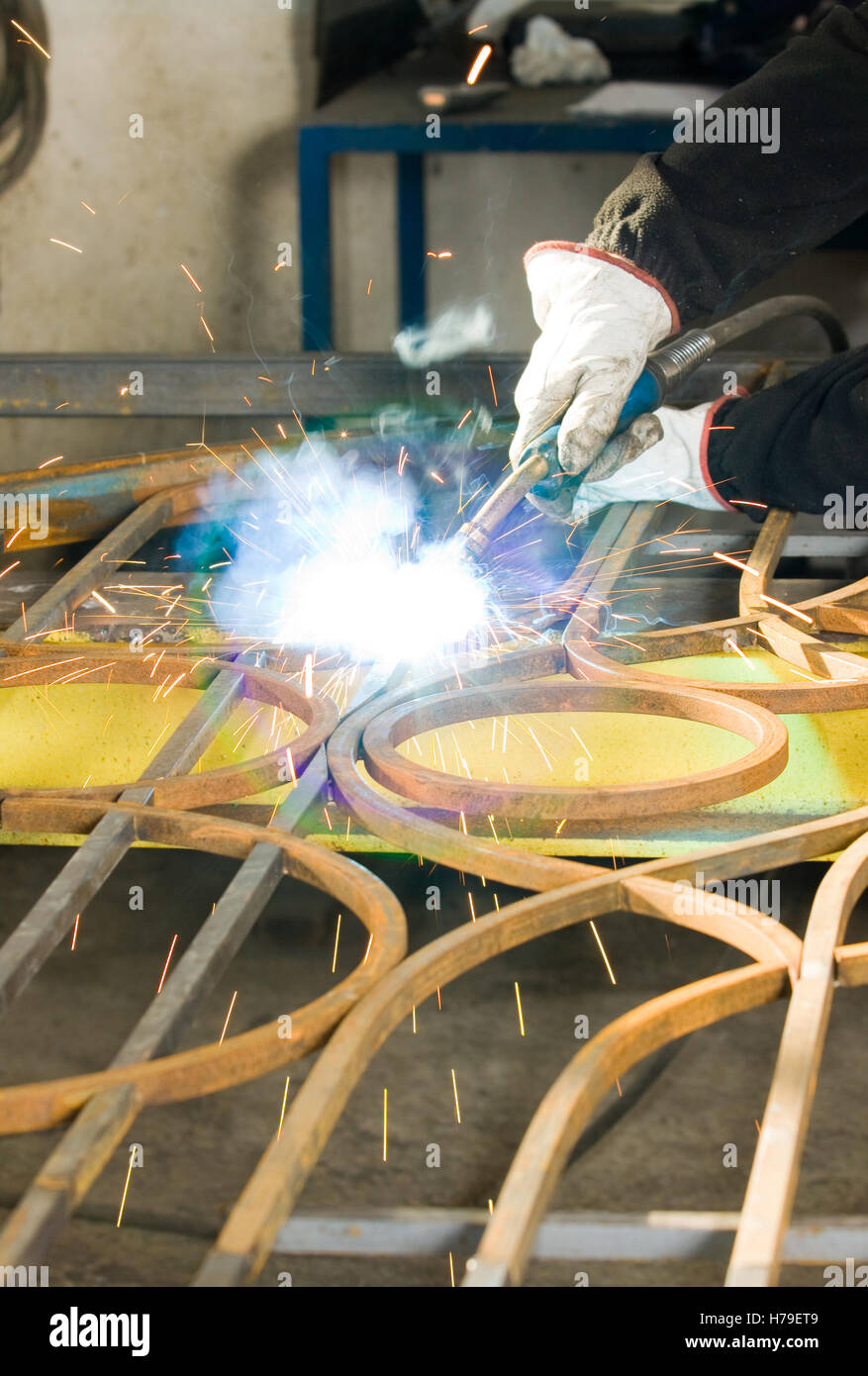 metalworker welding in his workshop Stock Photo - Alamy