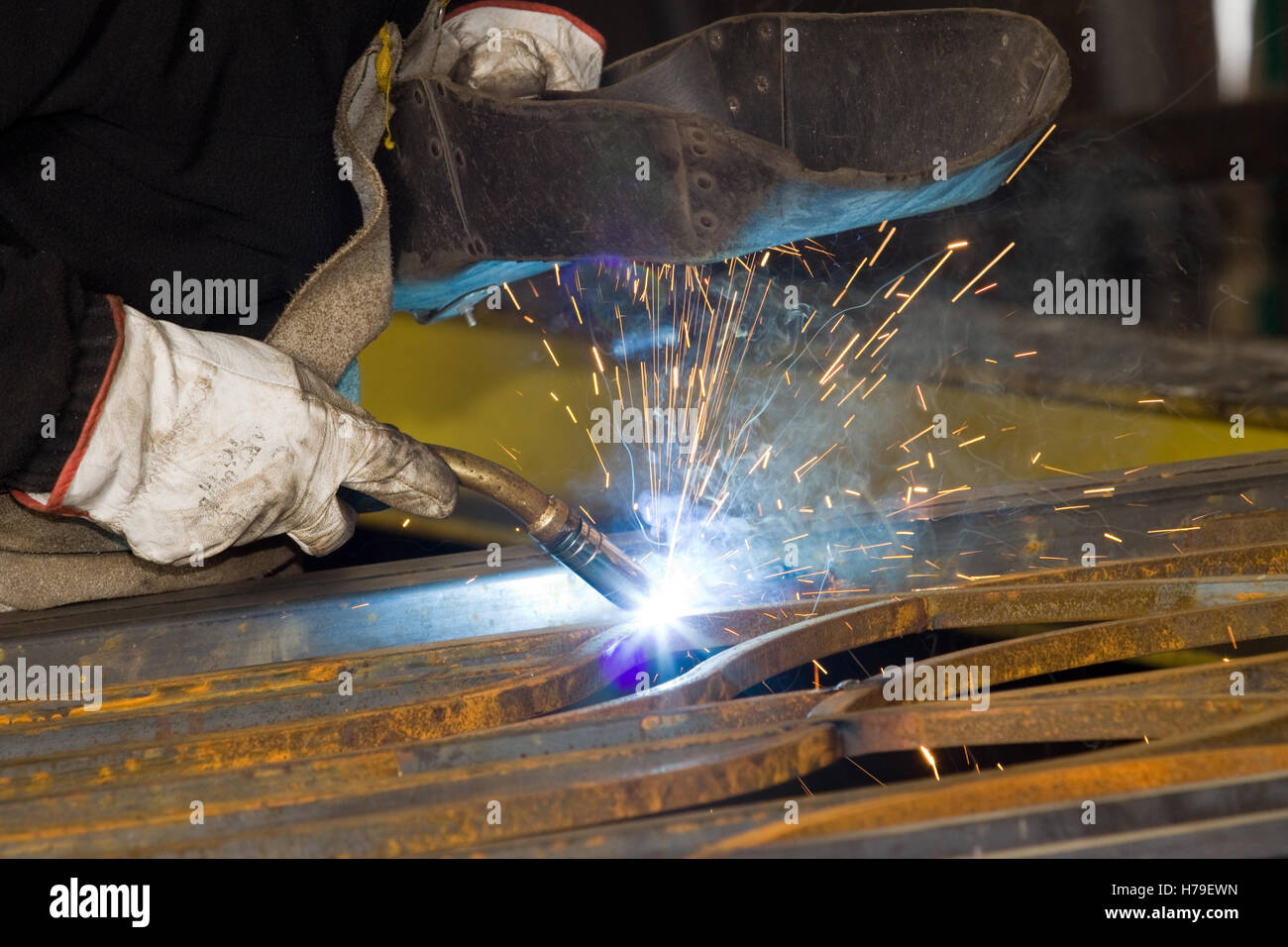 metalworker welding in his workshop Stock Photo - Alamy