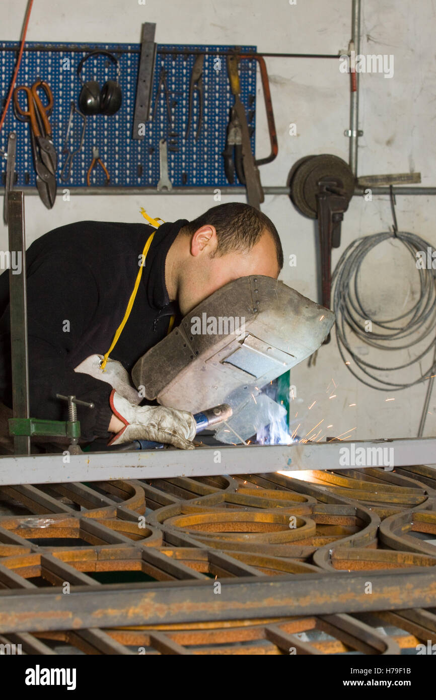 metalworker welding in his workshop Stock Photo - Alamy