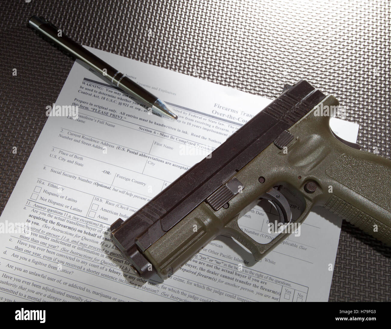 Handgun and paperwork required for a federal background check Stock ...