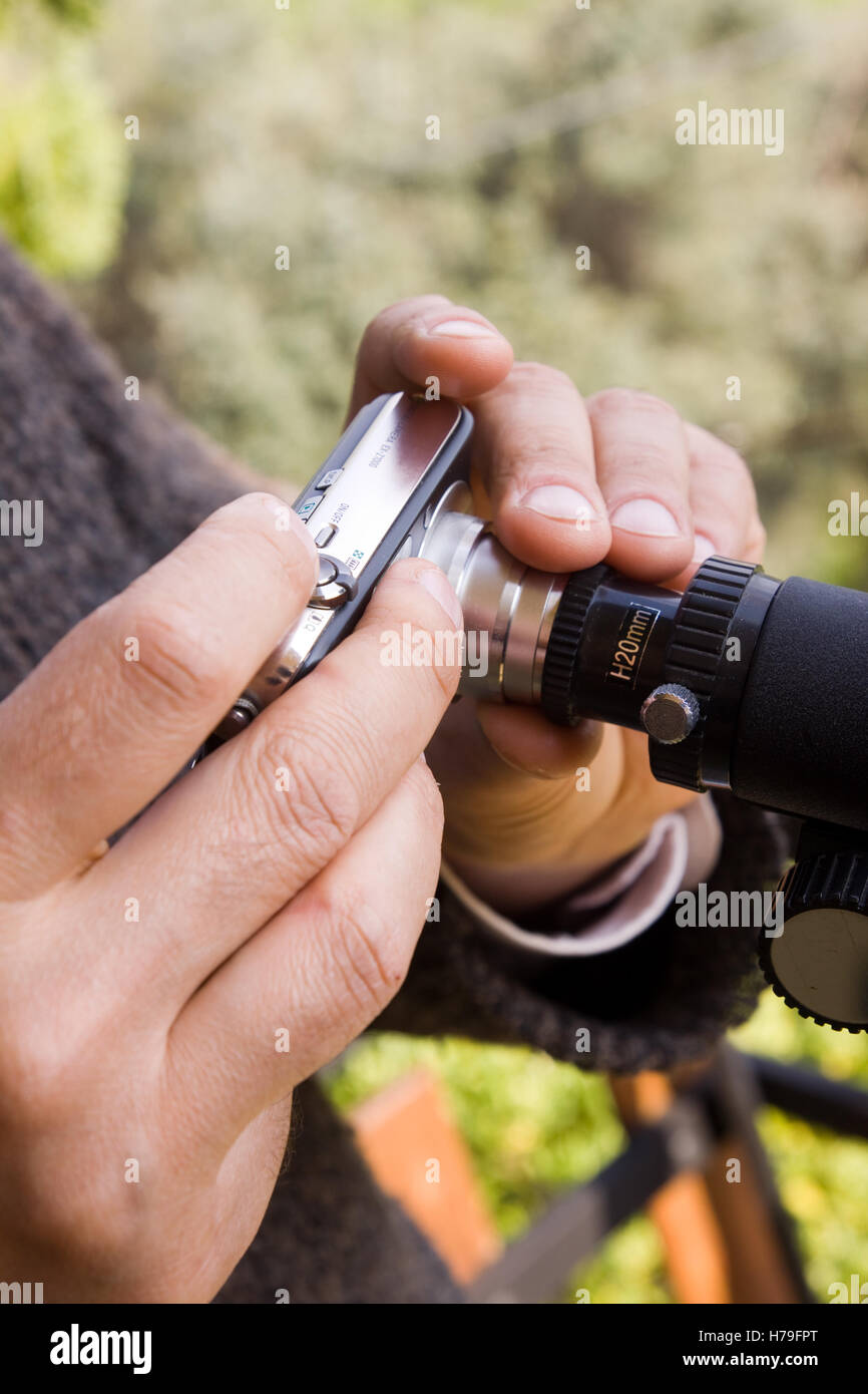 watching through the lens Stock Photo - Alamy