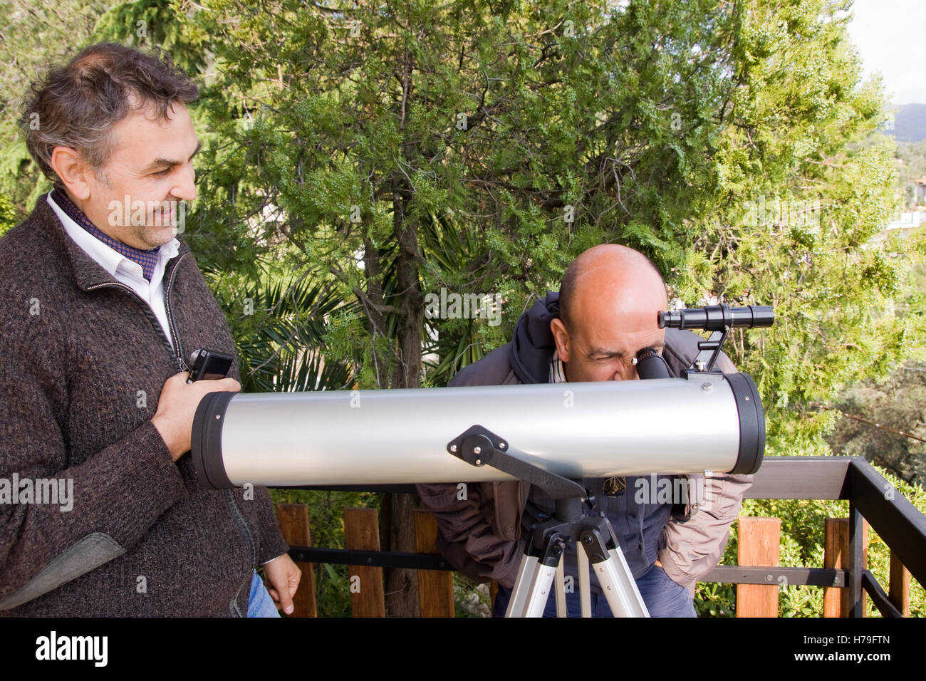 watching through the lens Stock Photo - Alamy