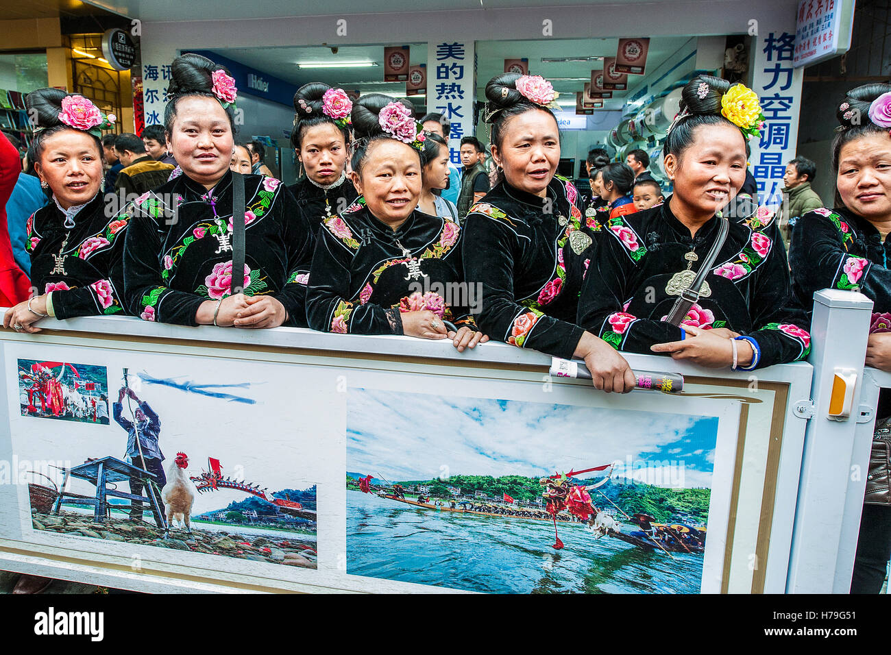 Women dressed in typical Miao costumes attending the parade of the ...
