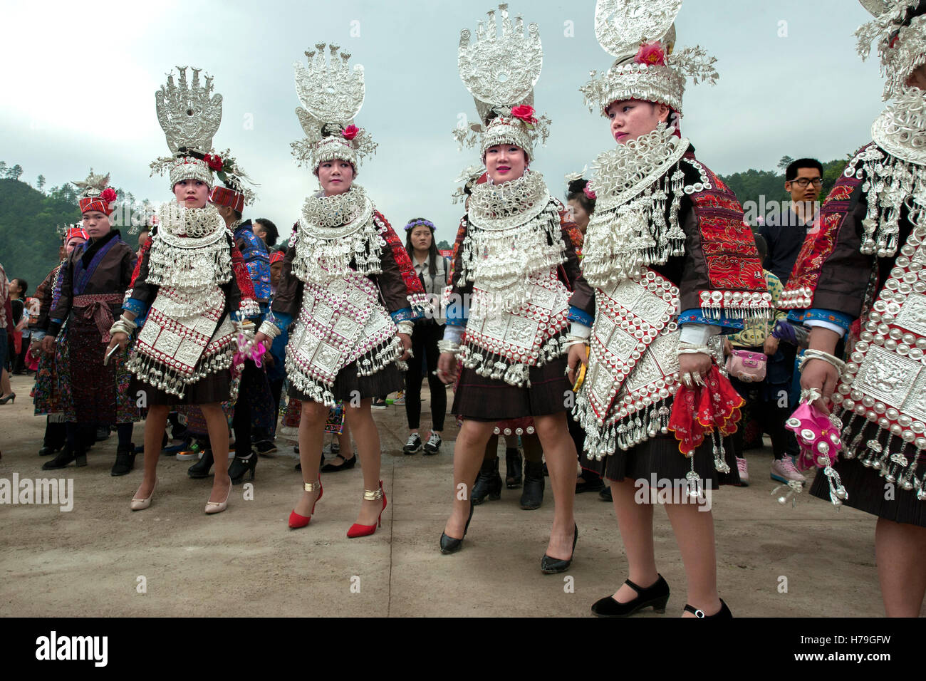 The Miao women and girls dressing their traditional costumes dance in ...